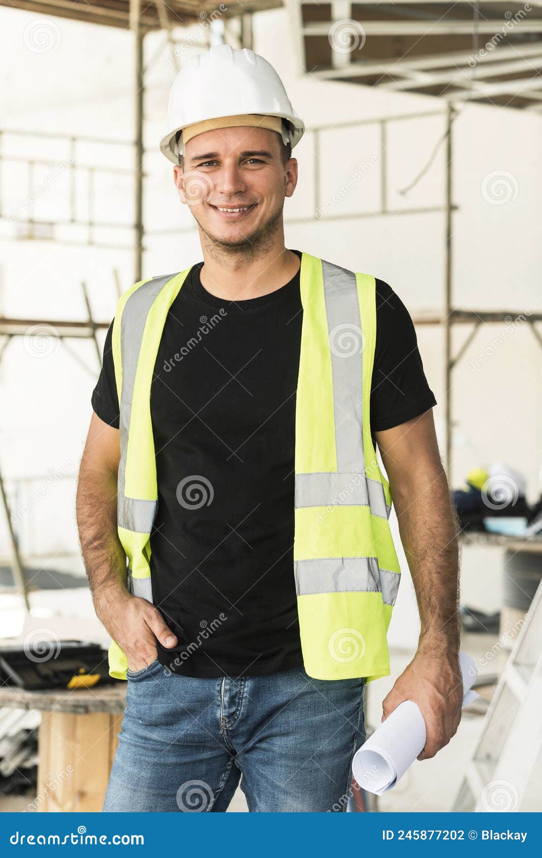 Worker Wearing Hard Hat Nad Safety Vest on a Construction Site Stock ...