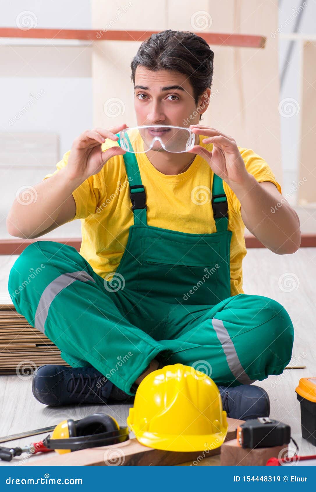 Worker Wearing Protective Goggles at Construction Site Stock Image ...