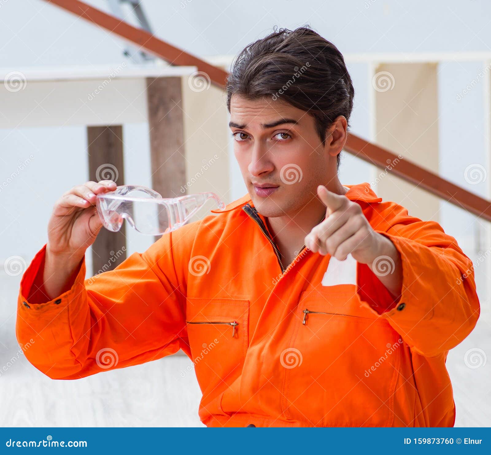 Worker Wearing Protective Goggles at Construction Site Stock Photo ...