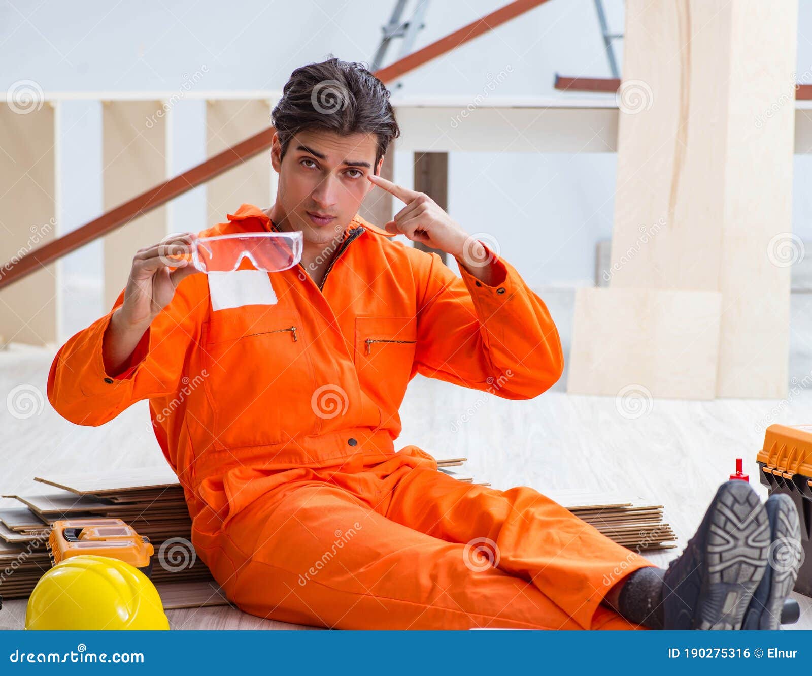 Worker Wearing Protective Goggles at Construction Site Stock Photo ...