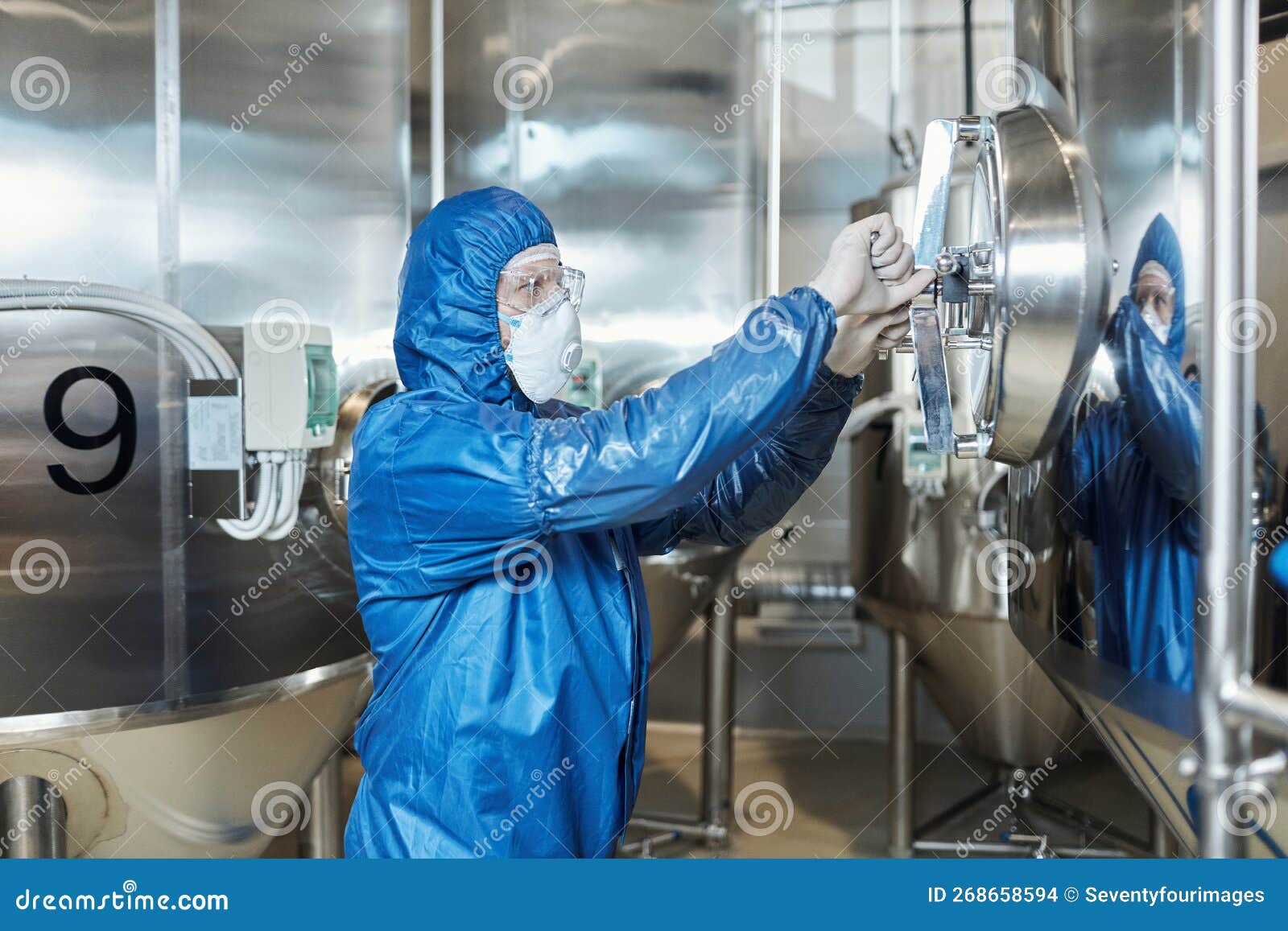 Worker Wearing Protective Suit Opening Vault Lock Stock Photo - Image ...
