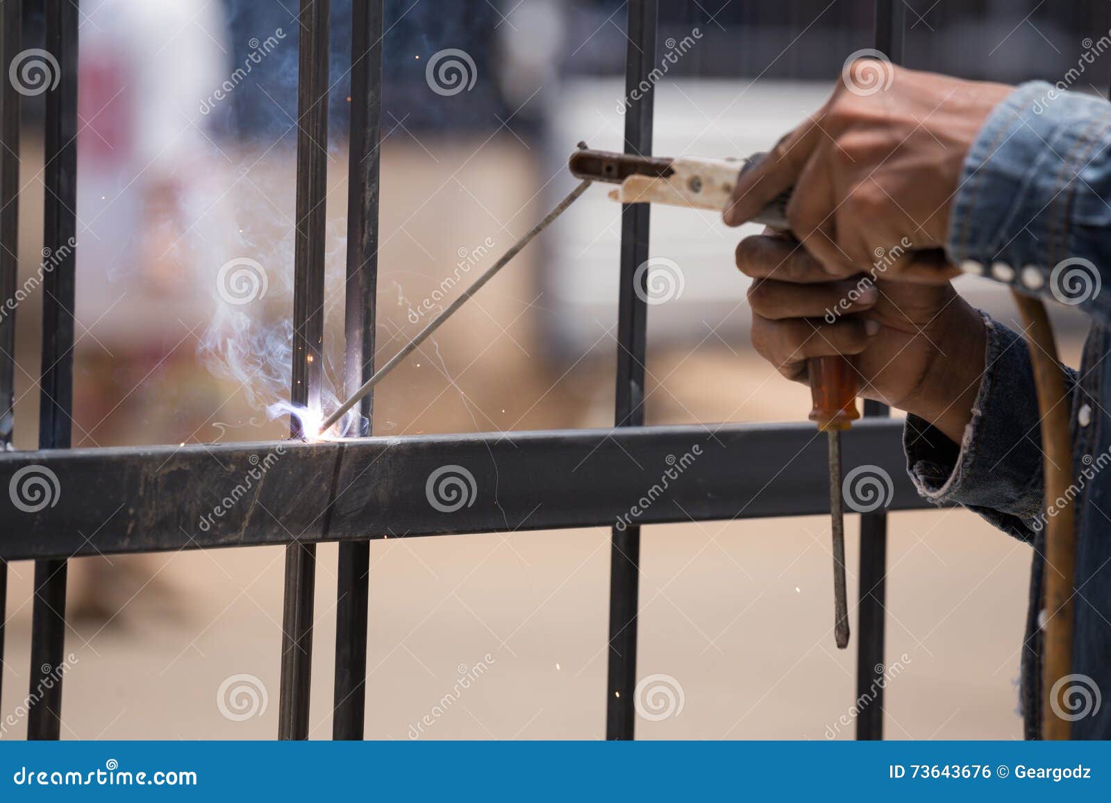 Worker welding door frames stock photo. Image of metal - 73643676