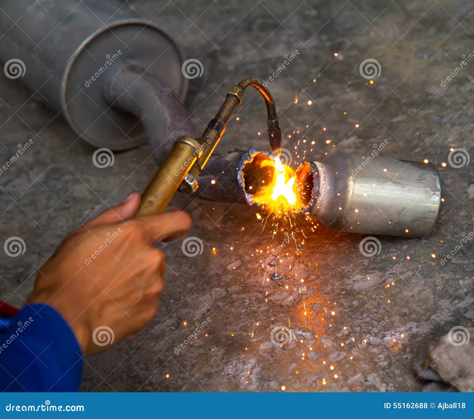 Worker Welding Metal Exhaust Pipe with Sparks Stock Photo - Image of ...