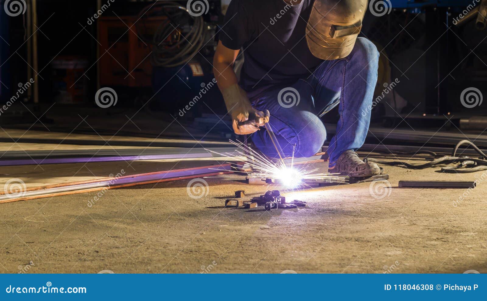 Worker Welding Metal, Focus on Flash Light Line of Sharp Spark,in Low ...