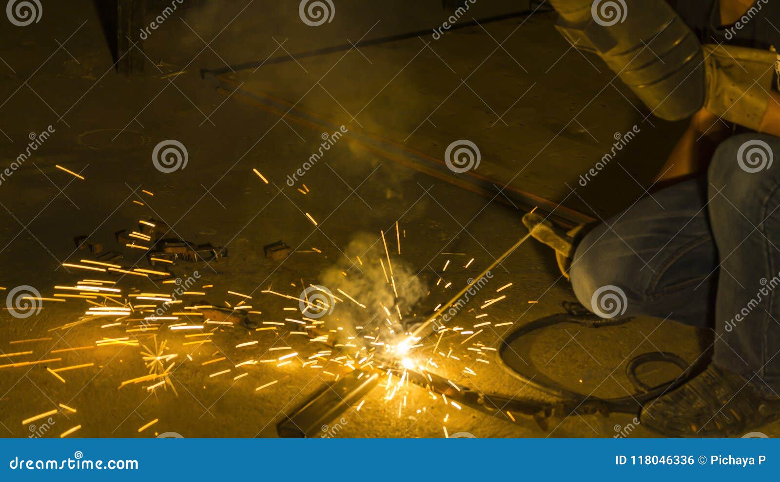 Worker Welding Metal, Focus on Flash Light Line of Sharp Spark,in Low ...