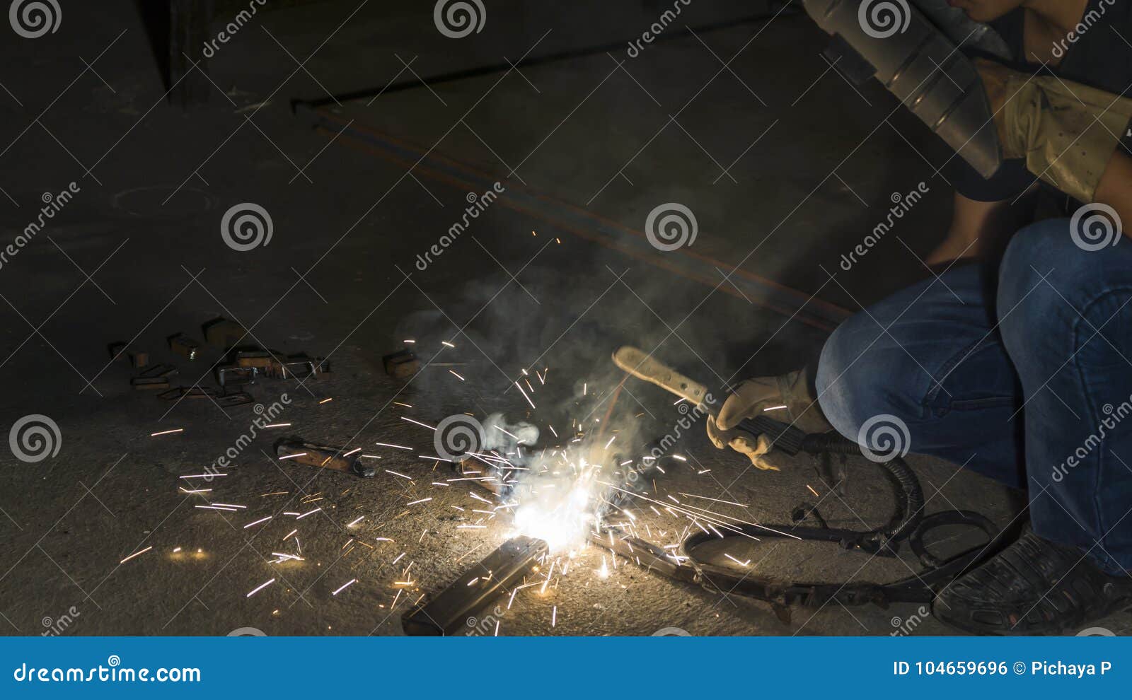 Worker Welding Metal, Focus on Flash Light Line of Sharp Spark,in Low ...
