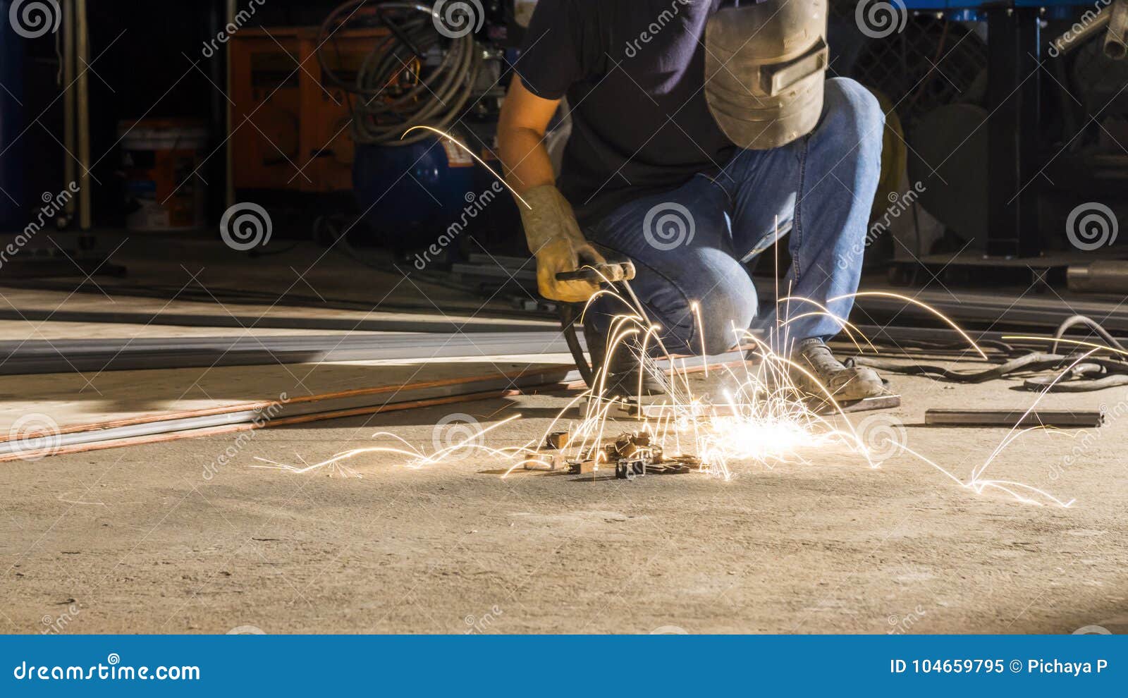 Worker Welding Metal, Focus on Flash Light Line of Sharp Spark,in Low ...