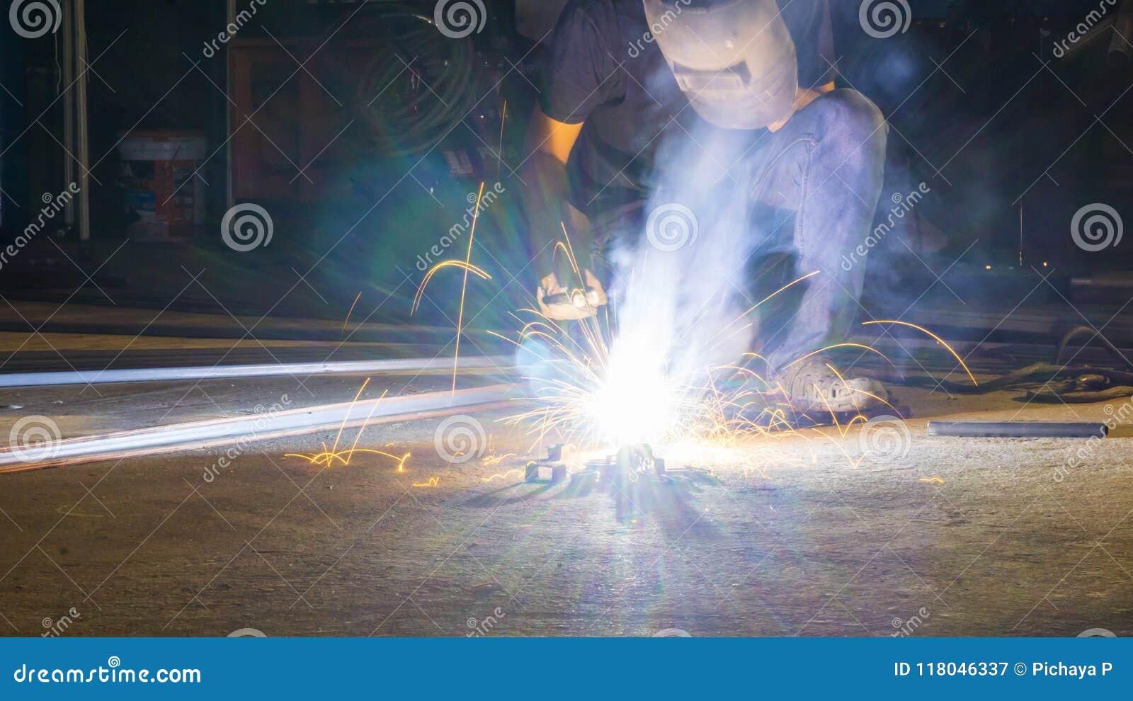 Worker Welding Metal, Focus on Flash Light Line of Sharp Spark,in Low ...