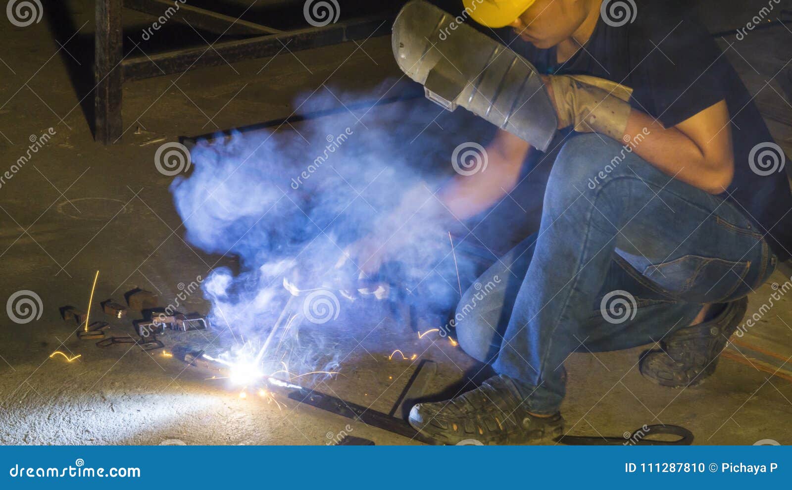 Worker Welding Metal, Focus on Flash Light Line of Sharp Spark,in Low ...