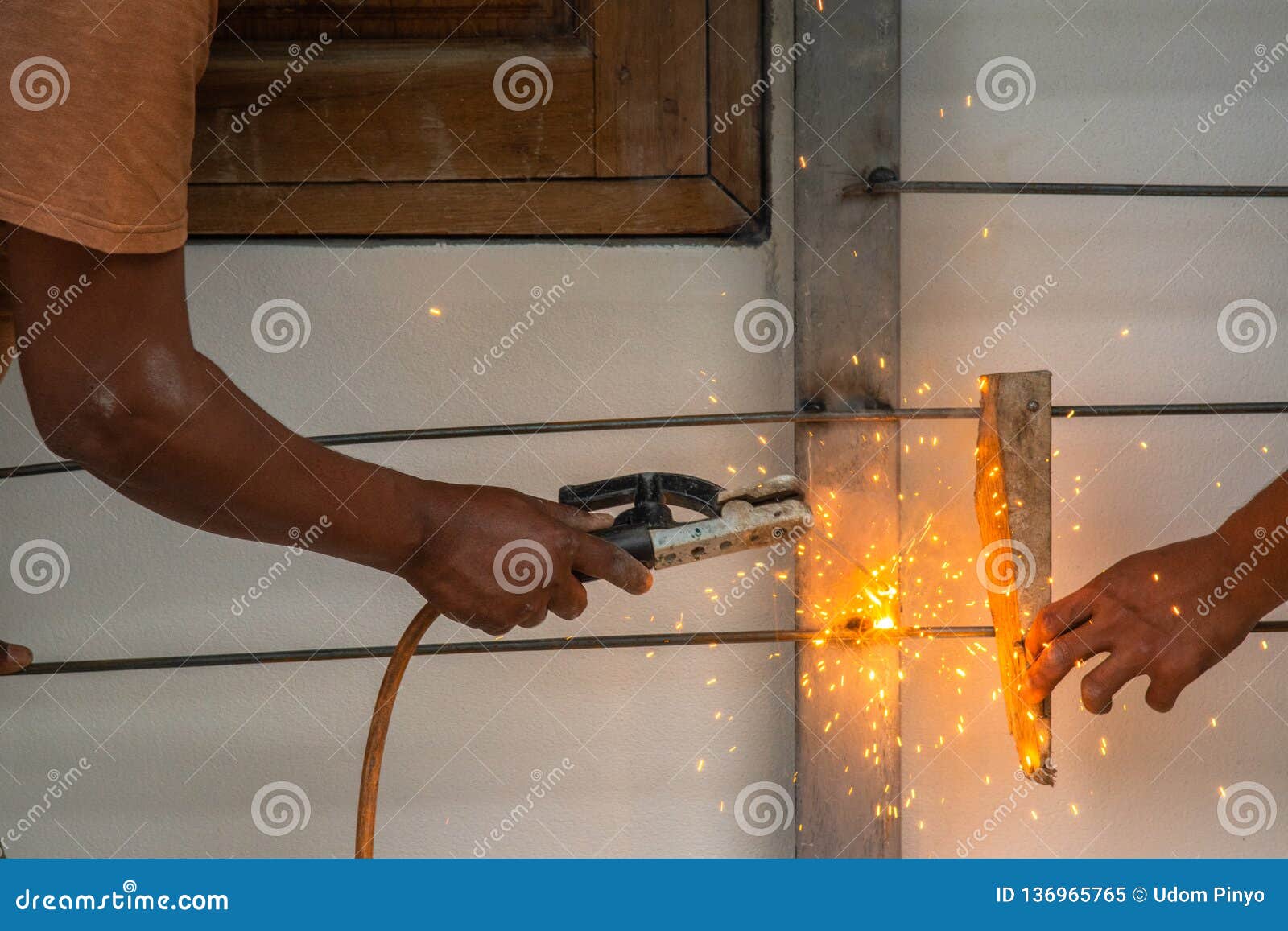 Worker welding steel bar. editorial image. Image of industrial - 136965765
