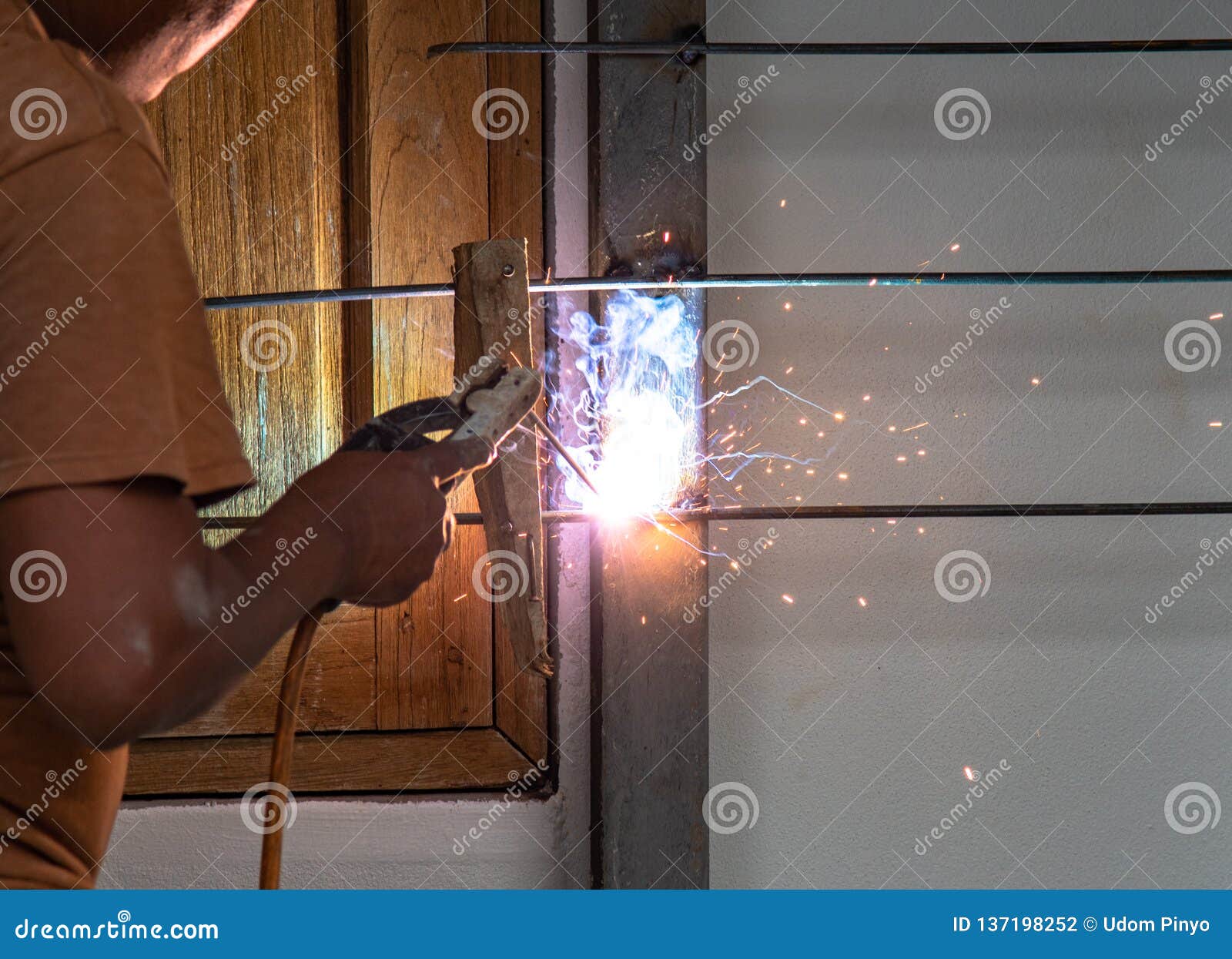 Worker welding steel bar. stock photo. Image of black - 137198252