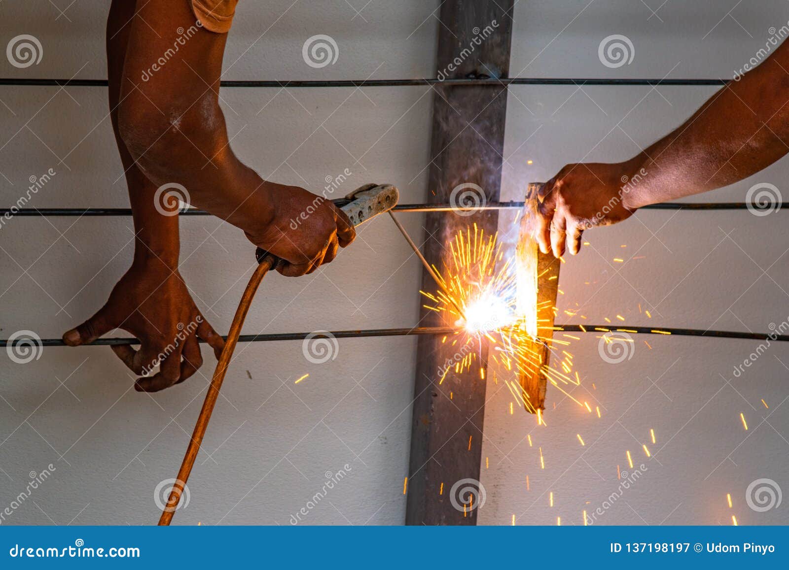 Worker welding steel bar. stock image. Image of engineering - 137198197