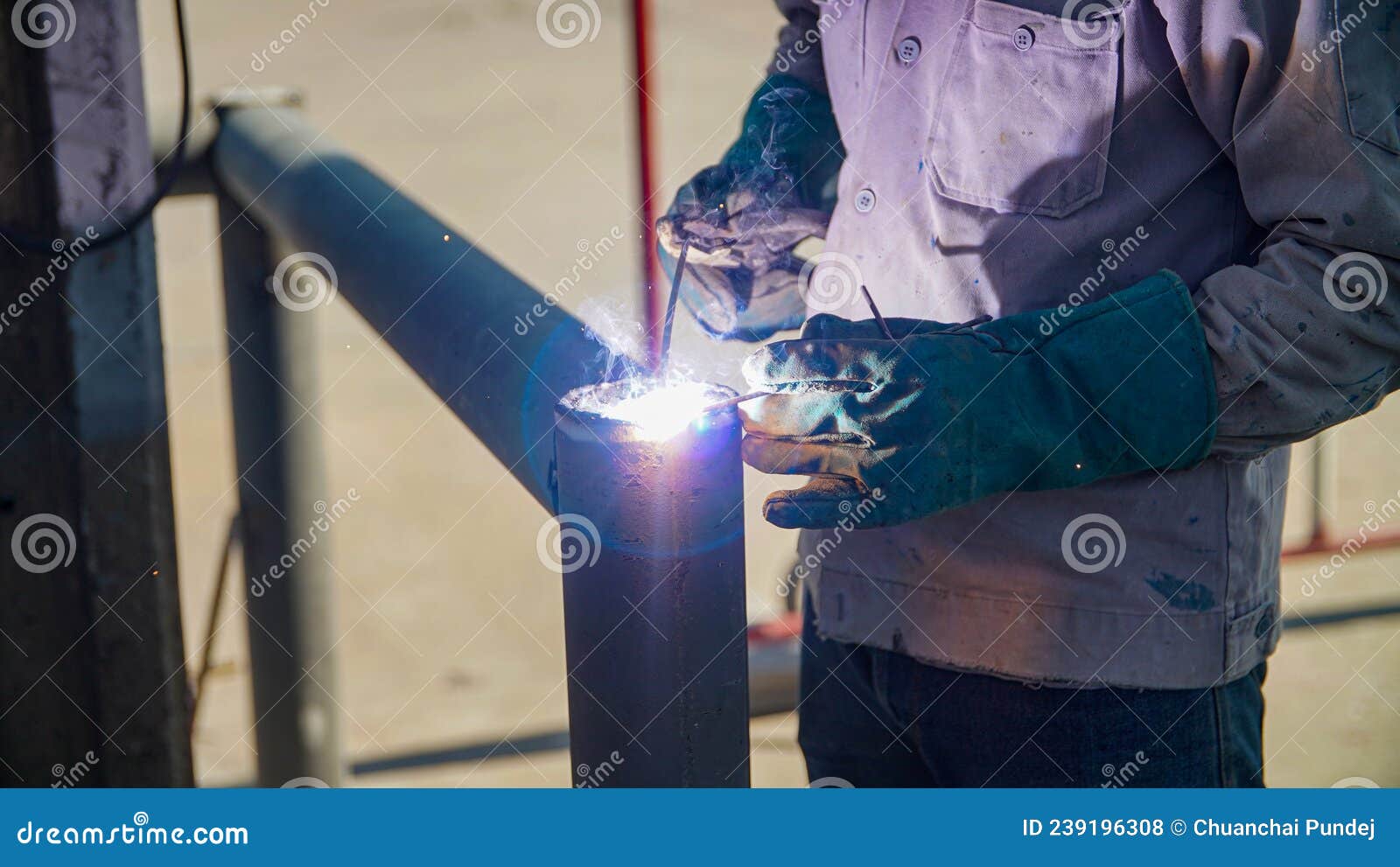 Worker is Welding Steel Frame Construction at Site. Stock Photo - Image ...