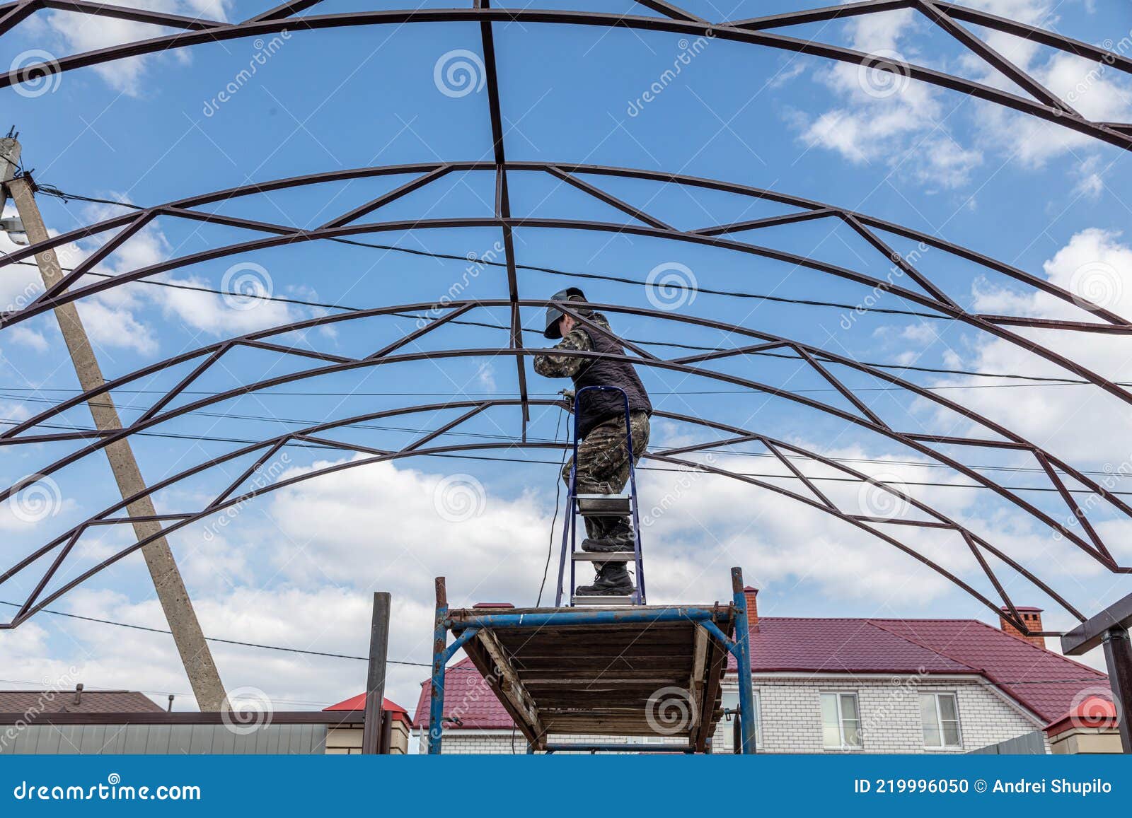 A Worker Welds Metal To the Canopy. Technologies Stock Photo - Image of ...