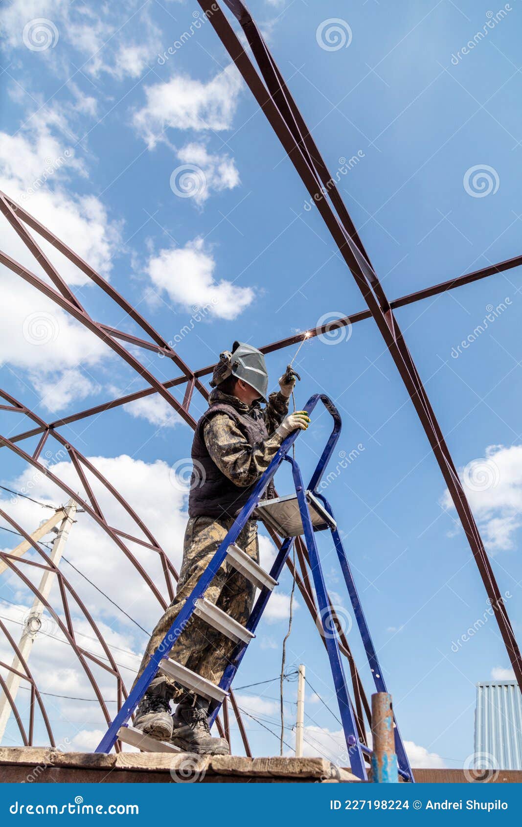 A Worker Welds Metal To the Canopy. Technologies Editorial Stock Image ...