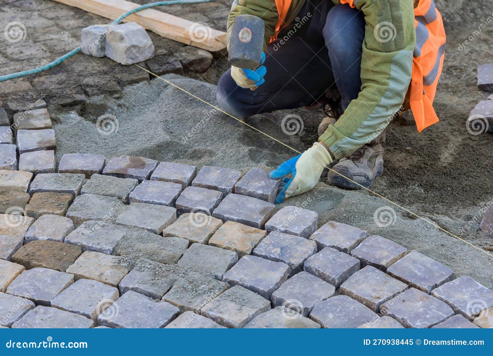 The Worker Were Carefully Laying the Granite Stones and Using ... The Worker Were Carefully Laying the Granite Stones and Using ...