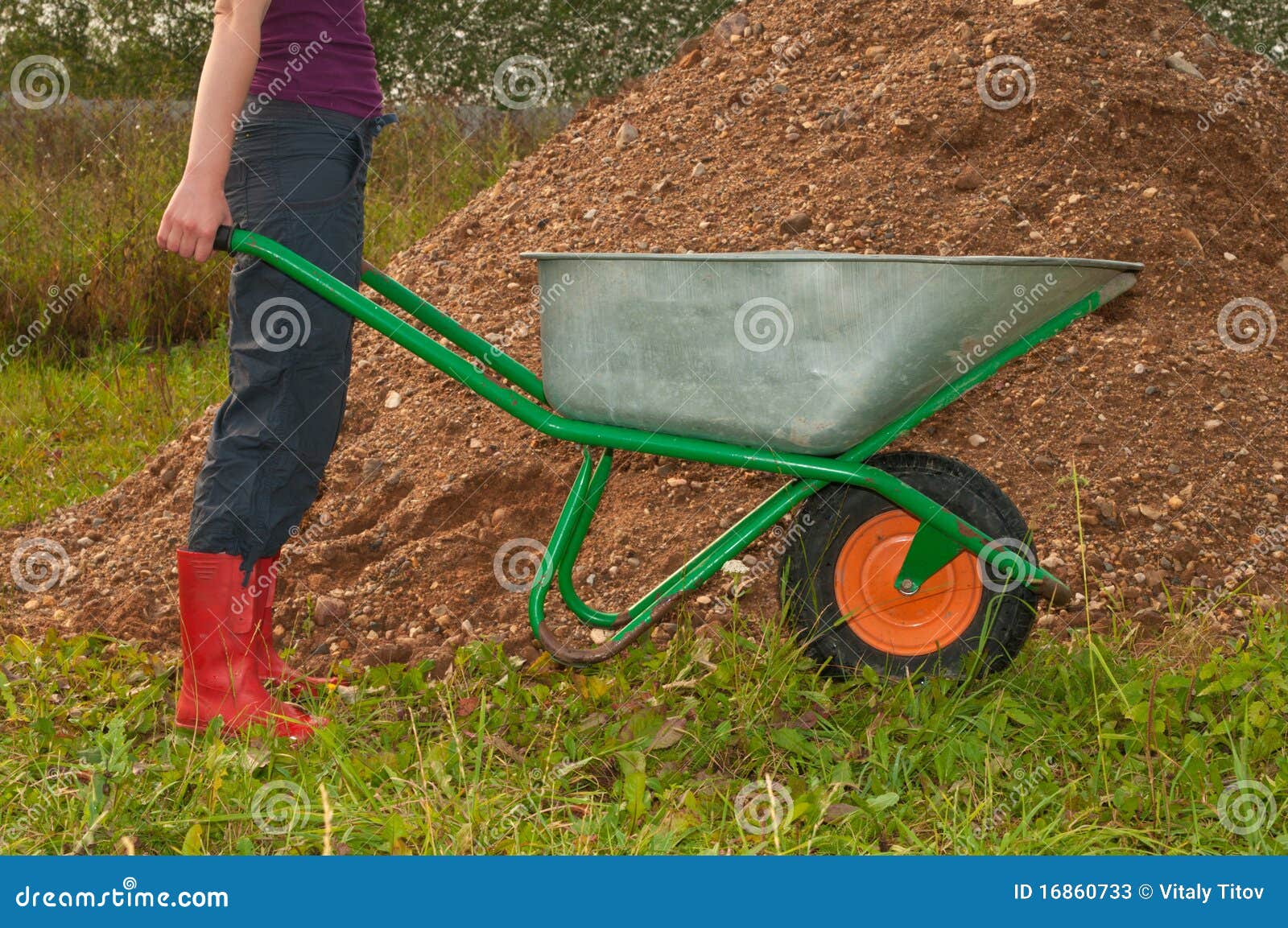 Worker with a wheelbarrow stock image. Image of gardening - 16860733
