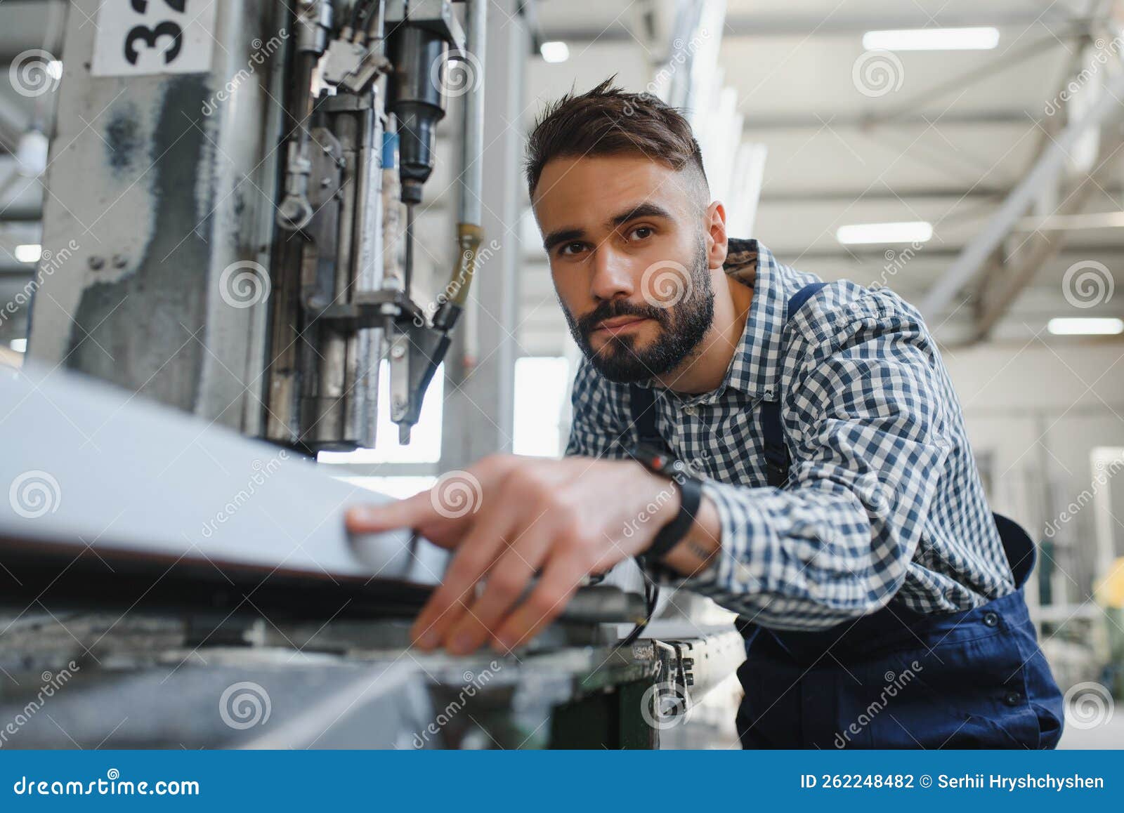 Worker at a Window Production Factory Selecting a Specific PVC Profile ...