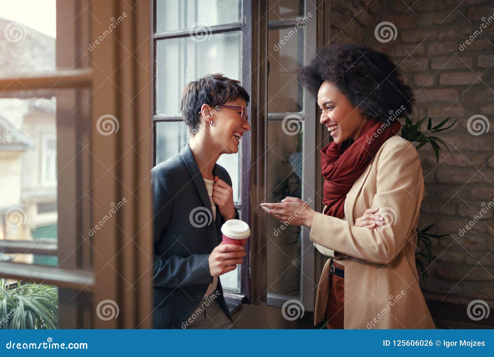 Women are Talking in Break Time in the Office Stock Photo - Image of ...