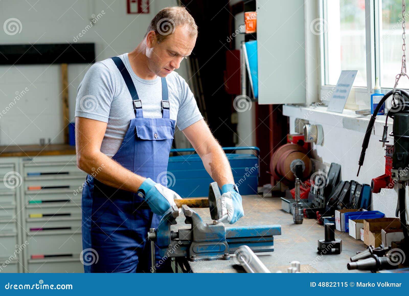 Worker on work bench stock image. Image of production - 48822115
