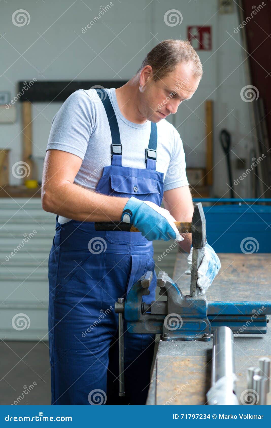 Worker on Work Bench in Factory Stock Photo - Image of occupation, tool ...