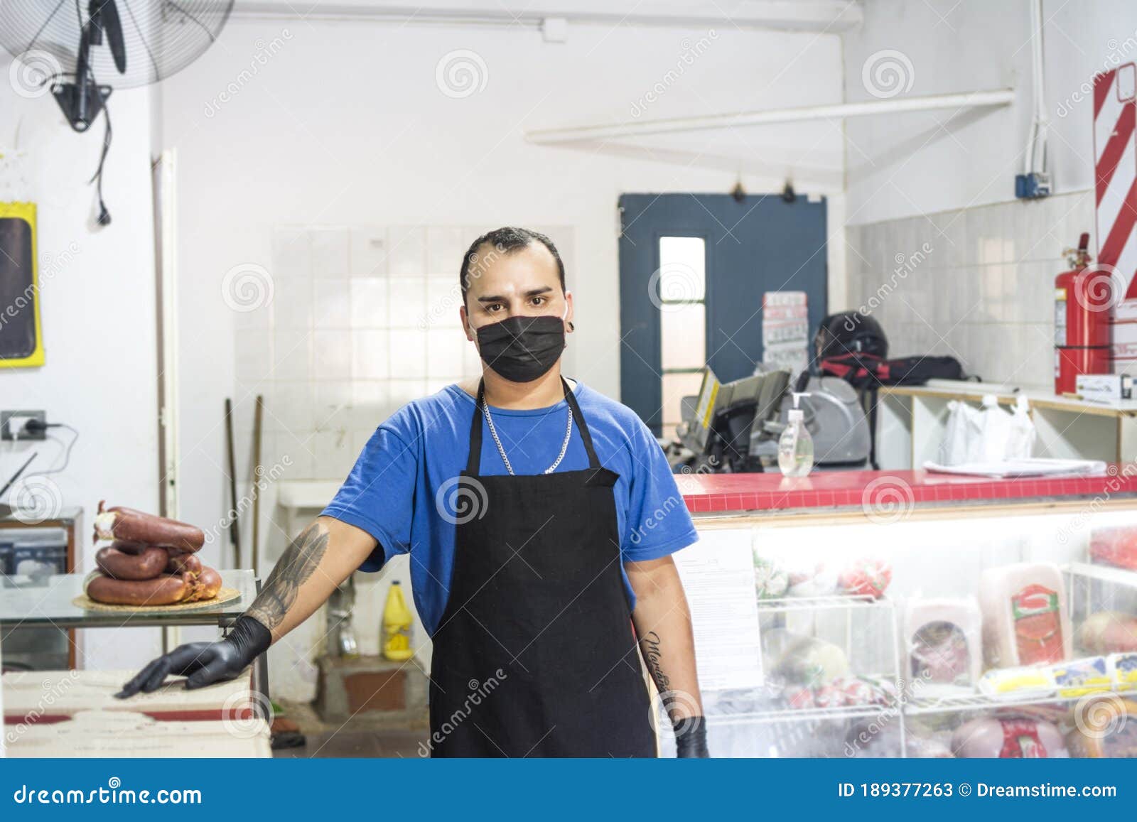 Worker Working in a Deli, Wearing a Black Apron Stock Image - Image of ...