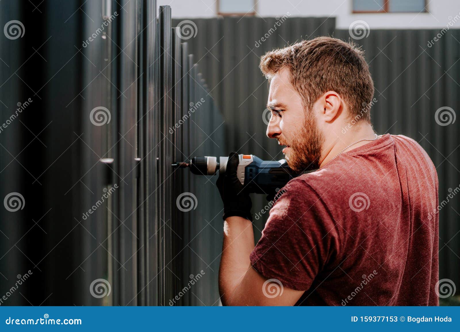 Working with an Electric Screwdriver on the Construction Site Stock ...