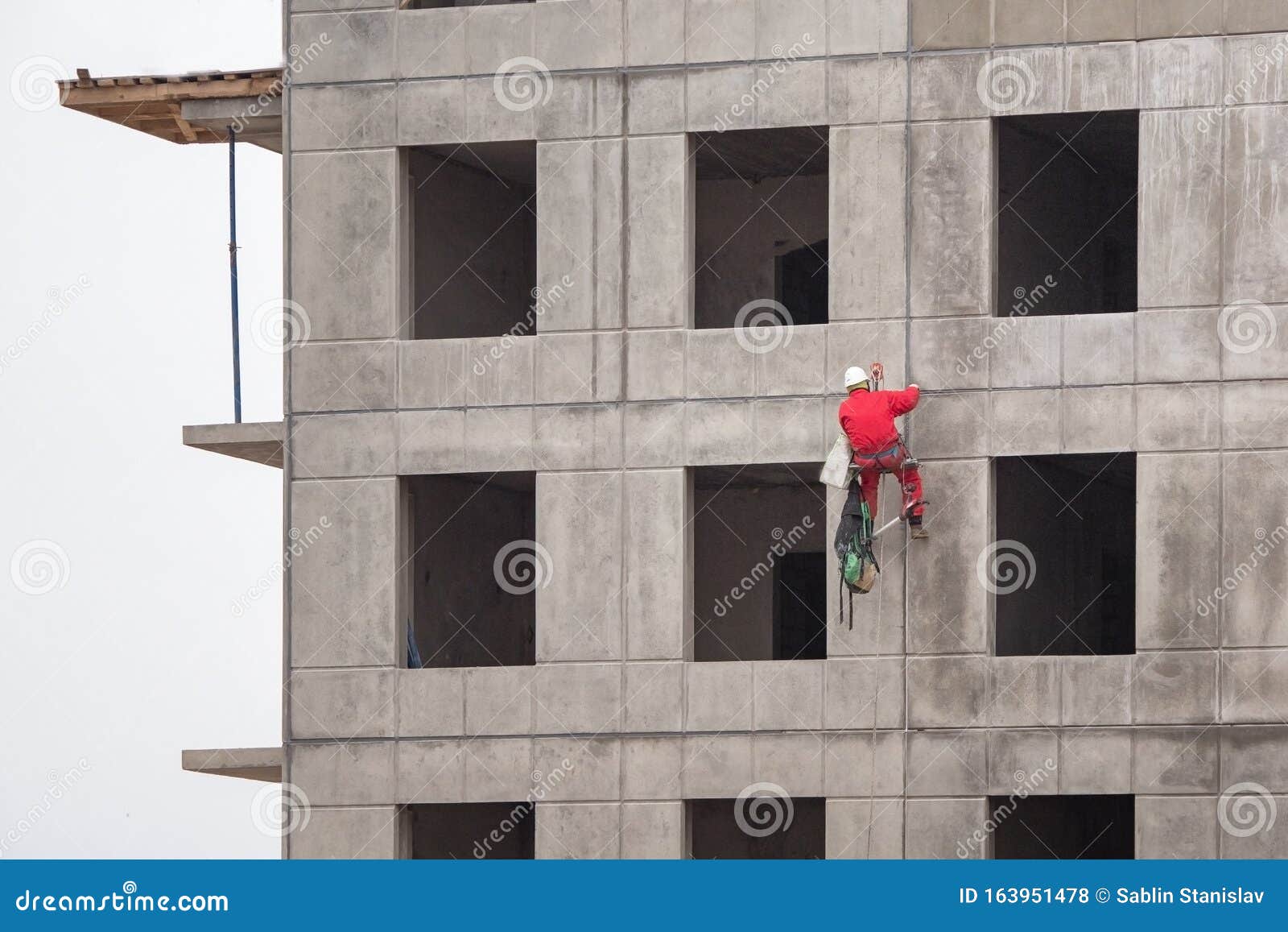 Worker Working on the Facade of the Building Stock Photo - Image of ...