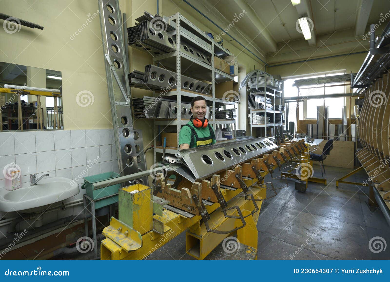 The Assembly Shop Interior. Light Plane, Worker Assembling A Body ...