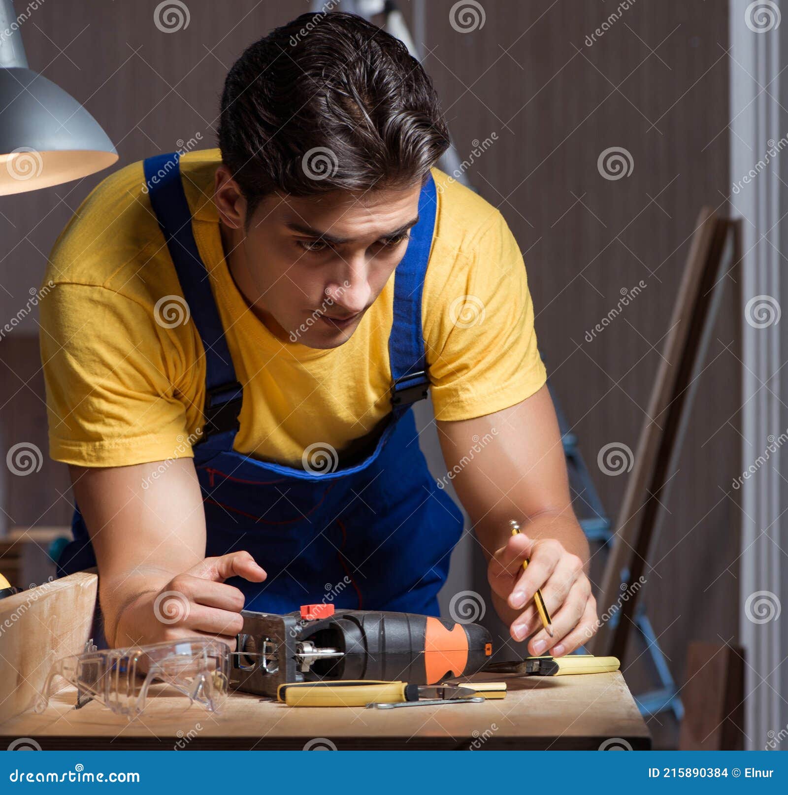 Worker Working in Repair Workshop in Woodworking Concept Stock Photo ...