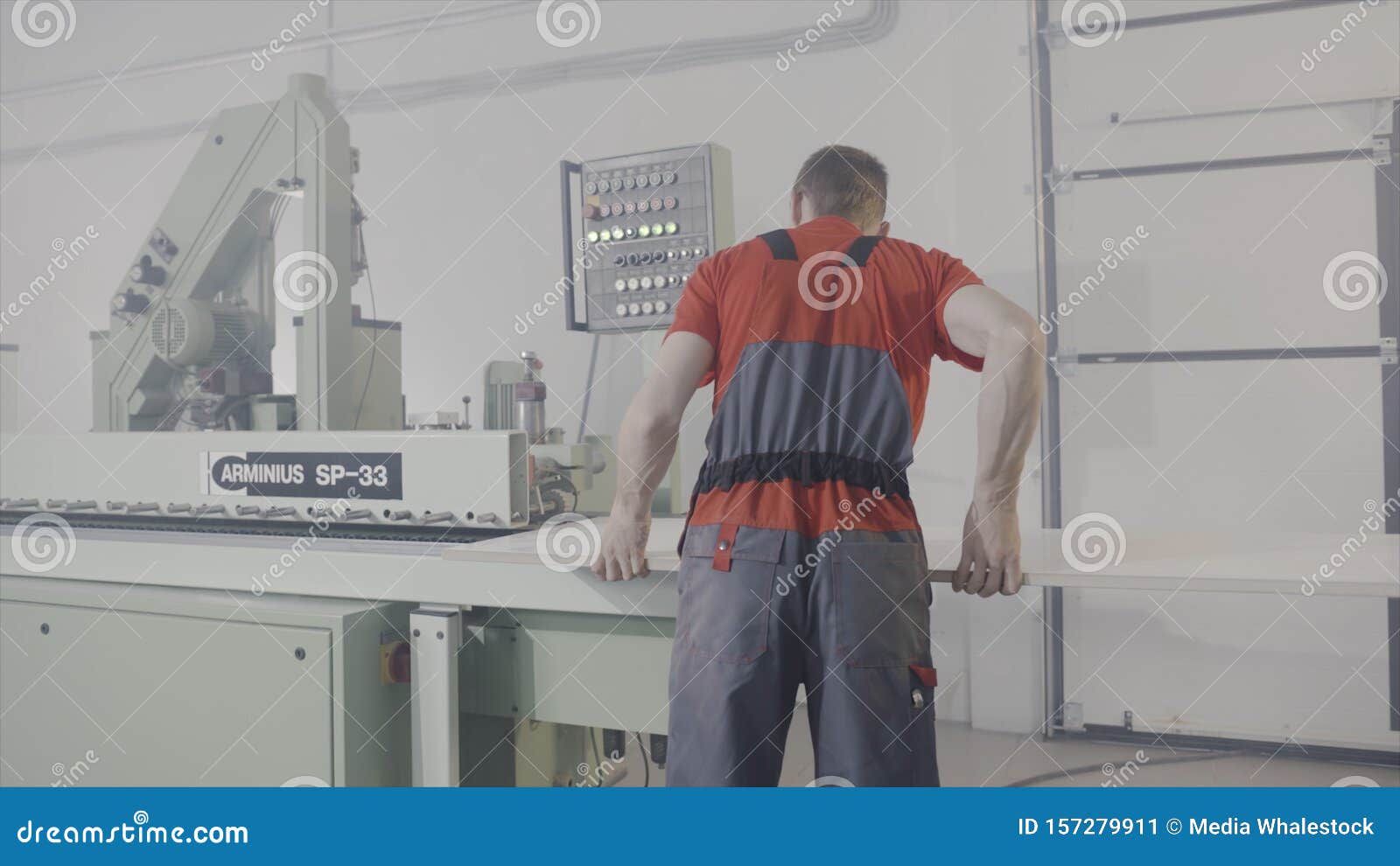 Worker Working at Sawing Machine in Production. Action Editorial Photo ...