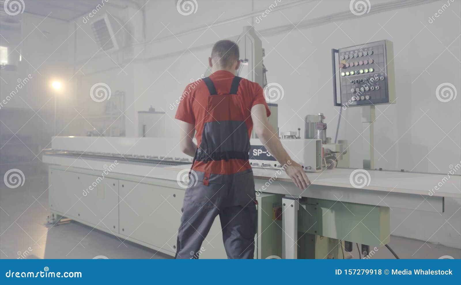 Worker Working at Sawing Machine in Production. Action Editorial Stock ...