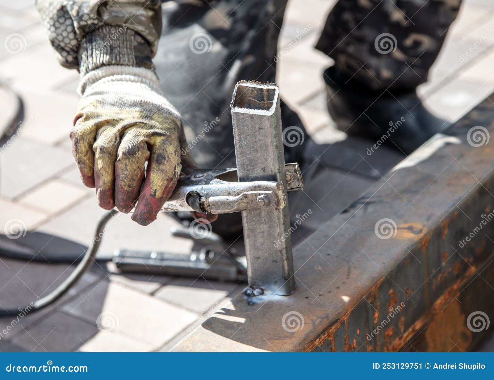 A Worker Works with Metal at a Construction Site. Stock Image - Image ...