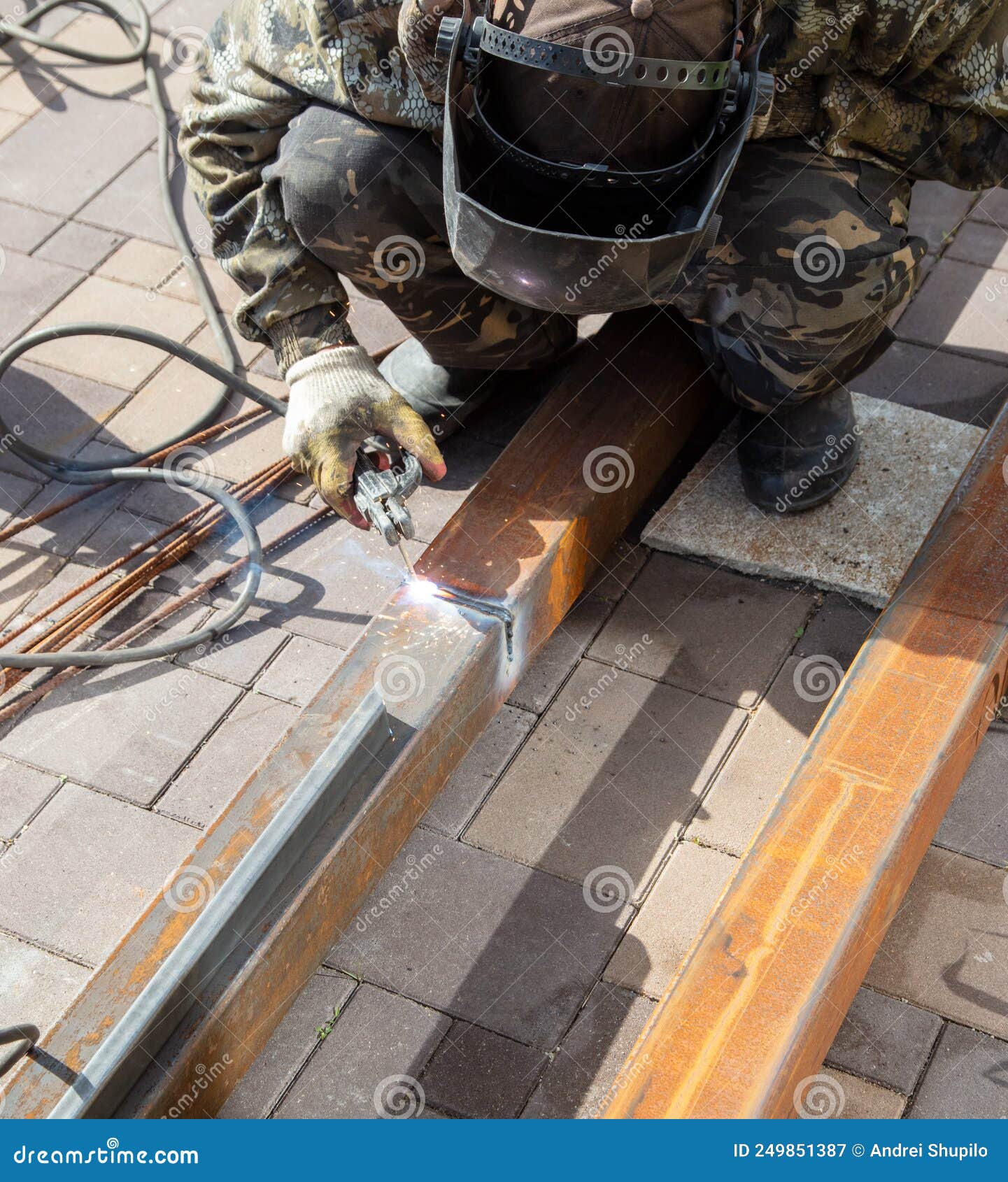 A Worker Works with Metal Welding at a Construction Site. Stock Image ...