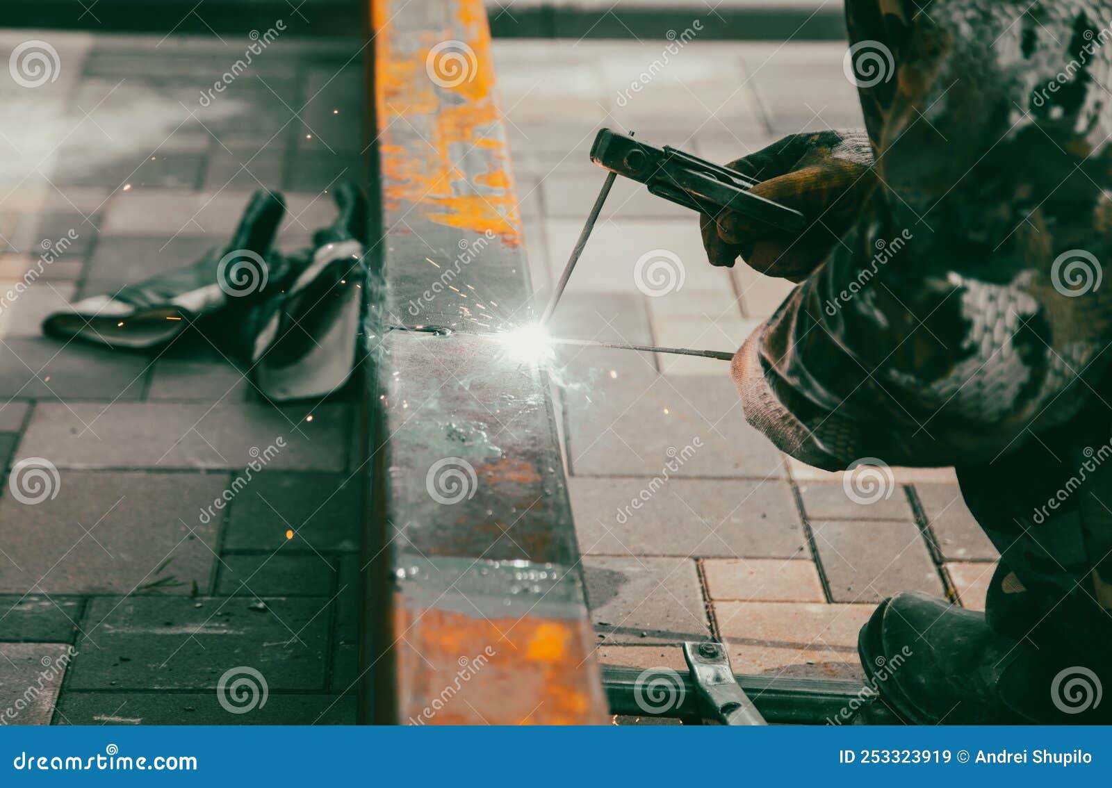 A Worker Works with Metal Welding at a Construction Site. Stock Image ...