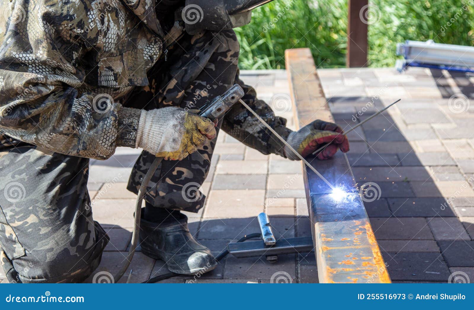 A Worker Works with Metal Welding at a Construction Site. Stock Image ...