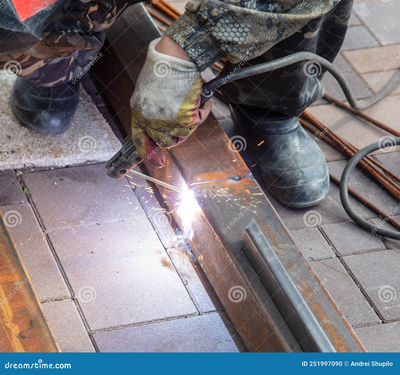 A Worker Works with Metal Welding at a Construction Site. Stock Photo ...