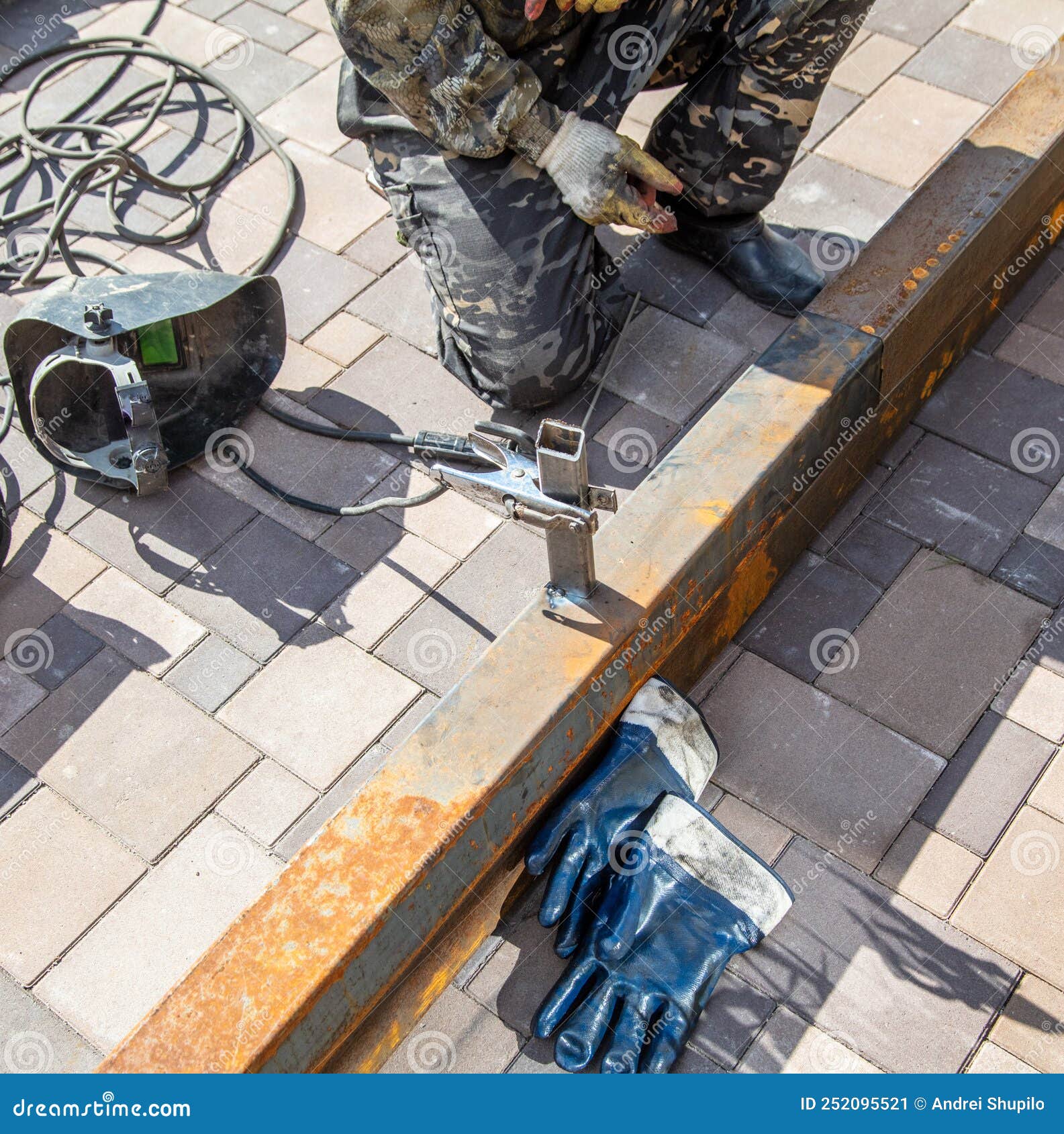 A Worker Works with Metal Welding at a Construction Site. Stock Image ...