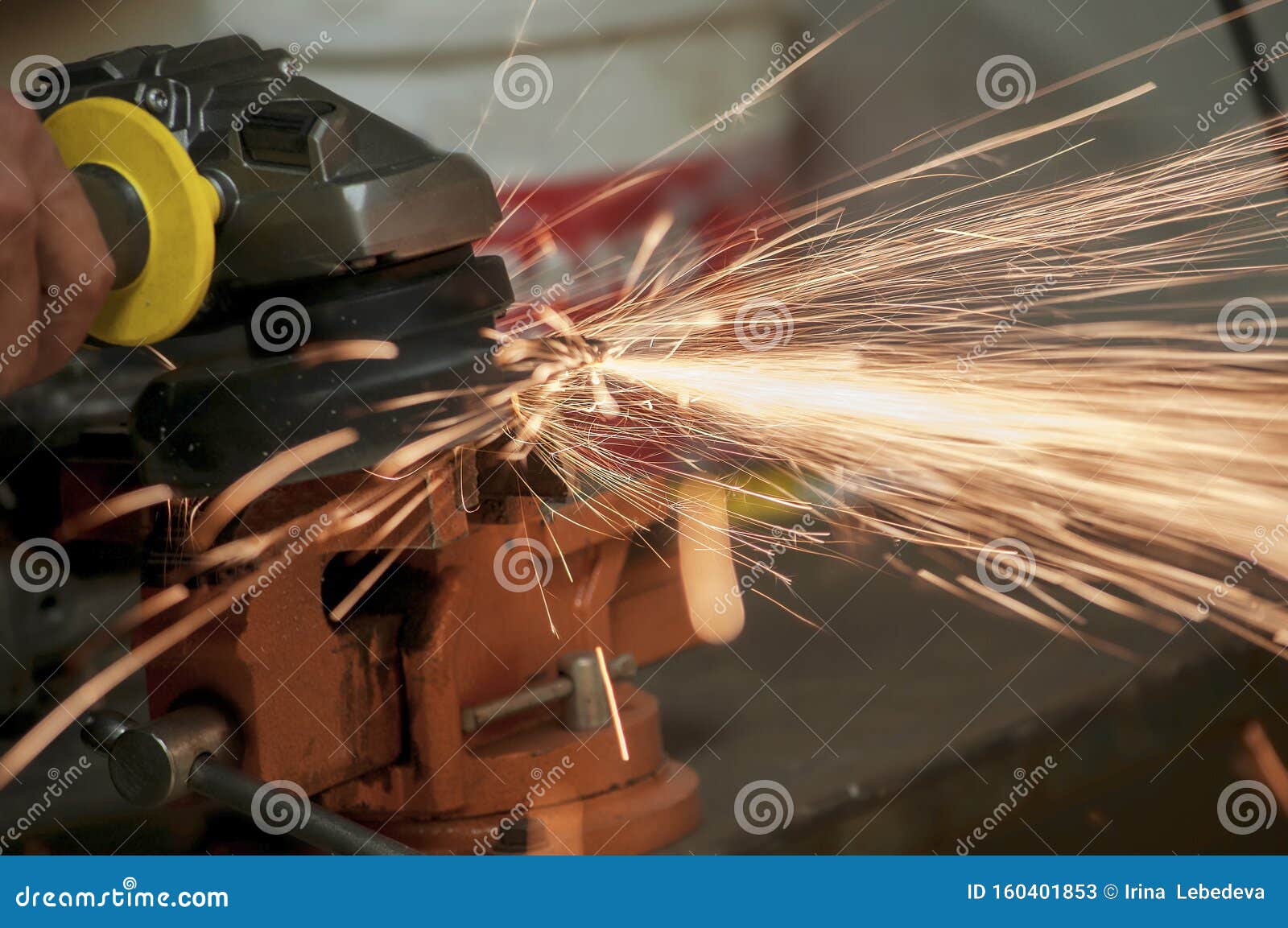 Worker in a Workshop Grinder Processes Metal, from Which Hot Bright ...