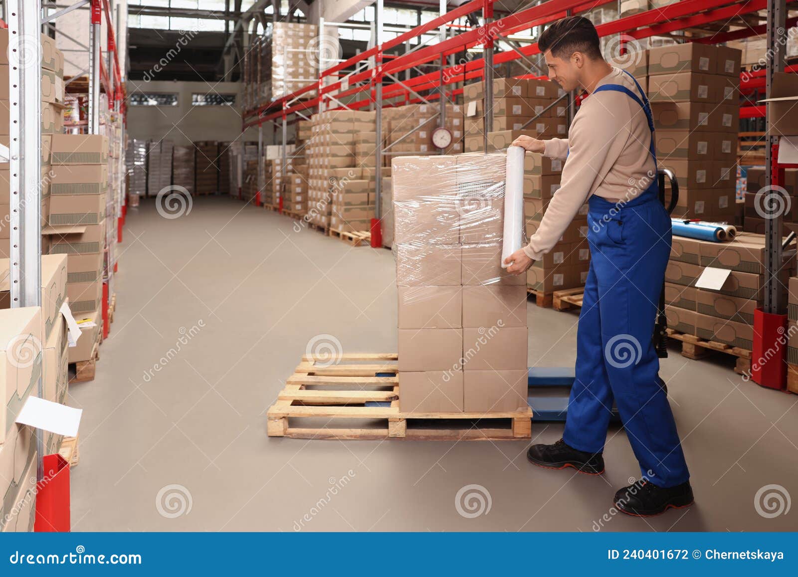 Worker Wrapping Boxes in Stretch Film at Warehouse Stock Photo - Image ...