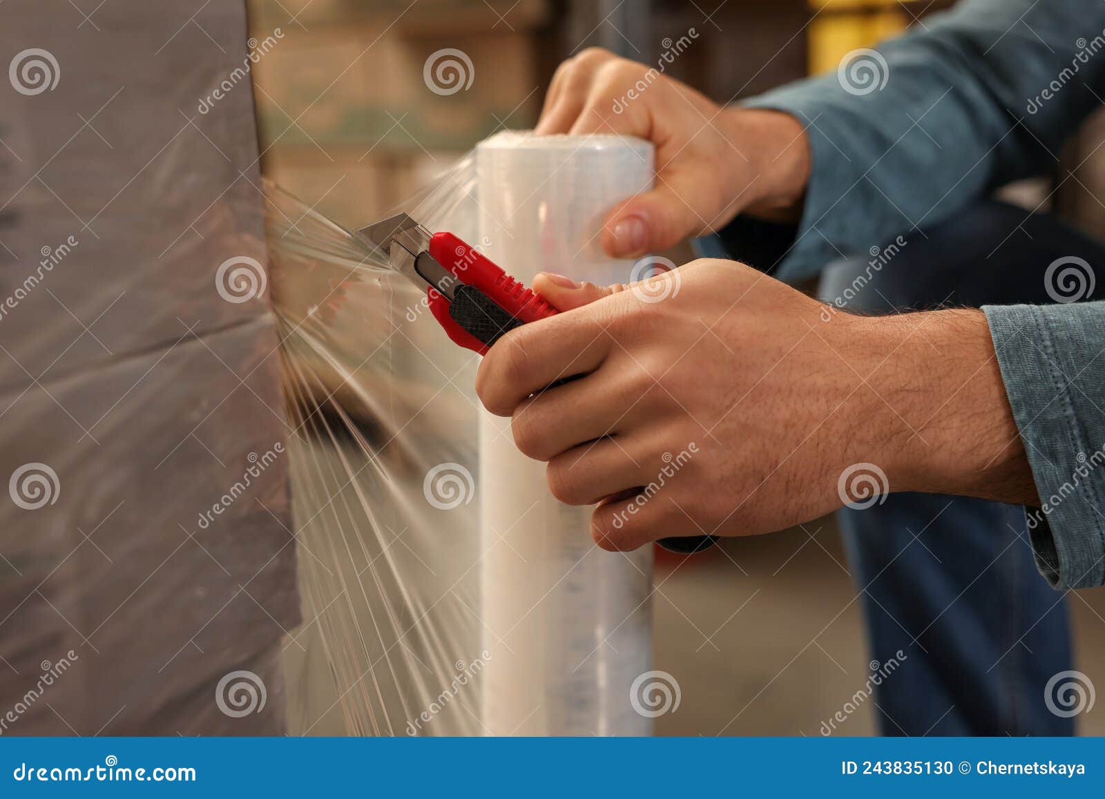 Worker Wrapping Boxes in Stretch Film at Warehouse, Closeup Stock Photo ...