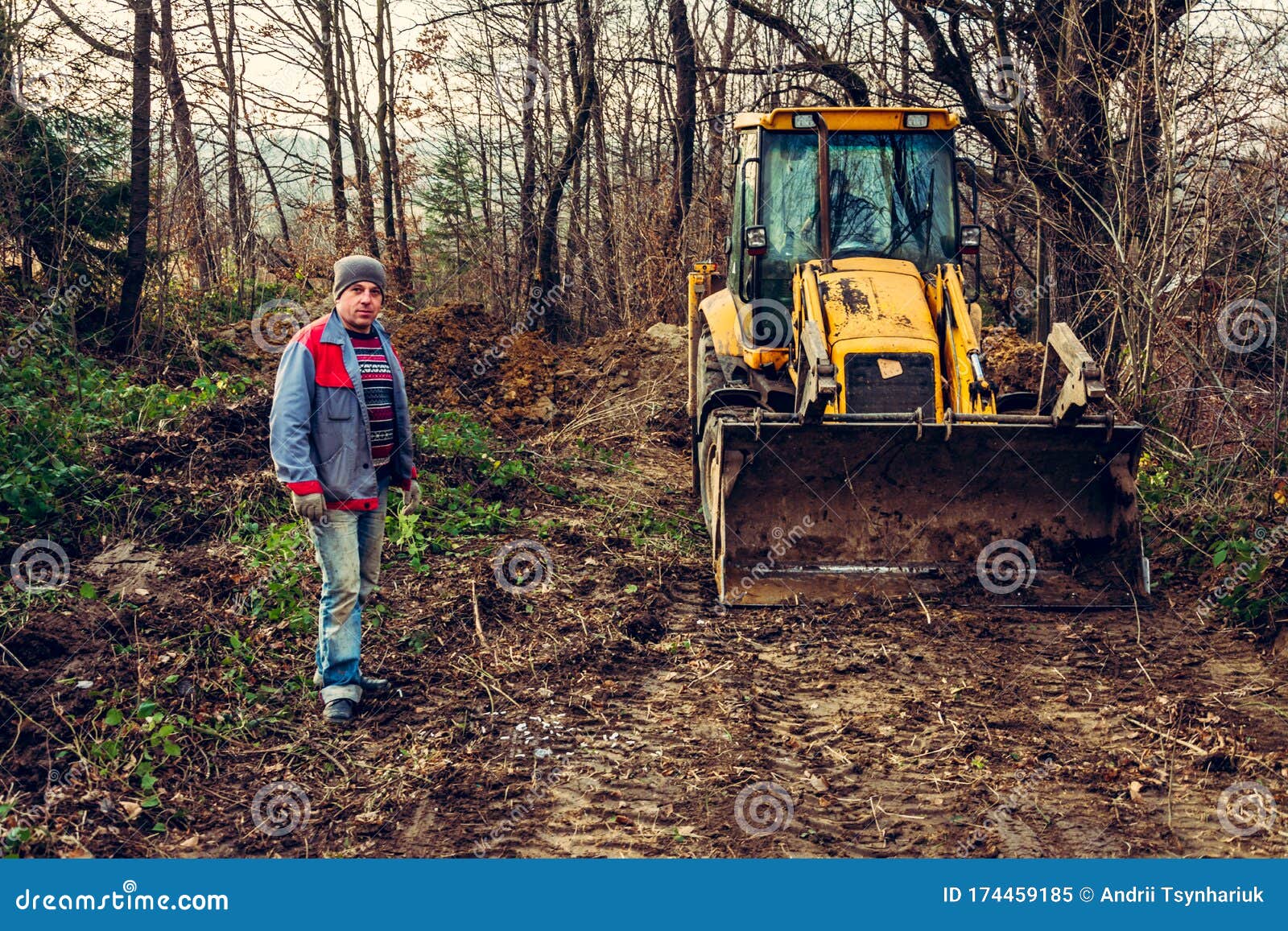 Worker and Yellow Old Excavator in the Forest Dig a Pit for Water ...
