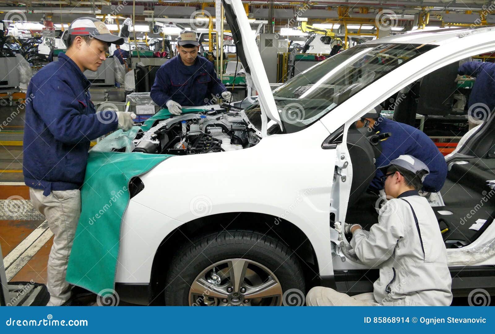 Workers Assemble a Car on Assembly Line in Car Factory Editorial Stock ... Workers Assemble a Car on Assembly Line in Car Factory Editorial Stock ...