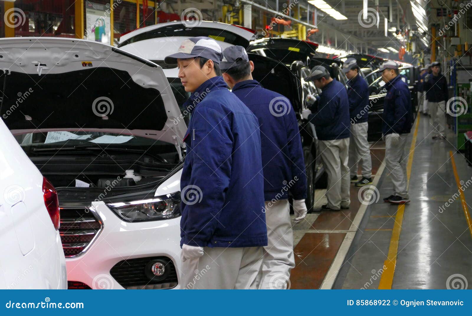 Workers Assemble a Car on Assembly Line in Car Factory Editorial ... Workers Assemble a Car on Assembly Line in Car Factory Editorial ...