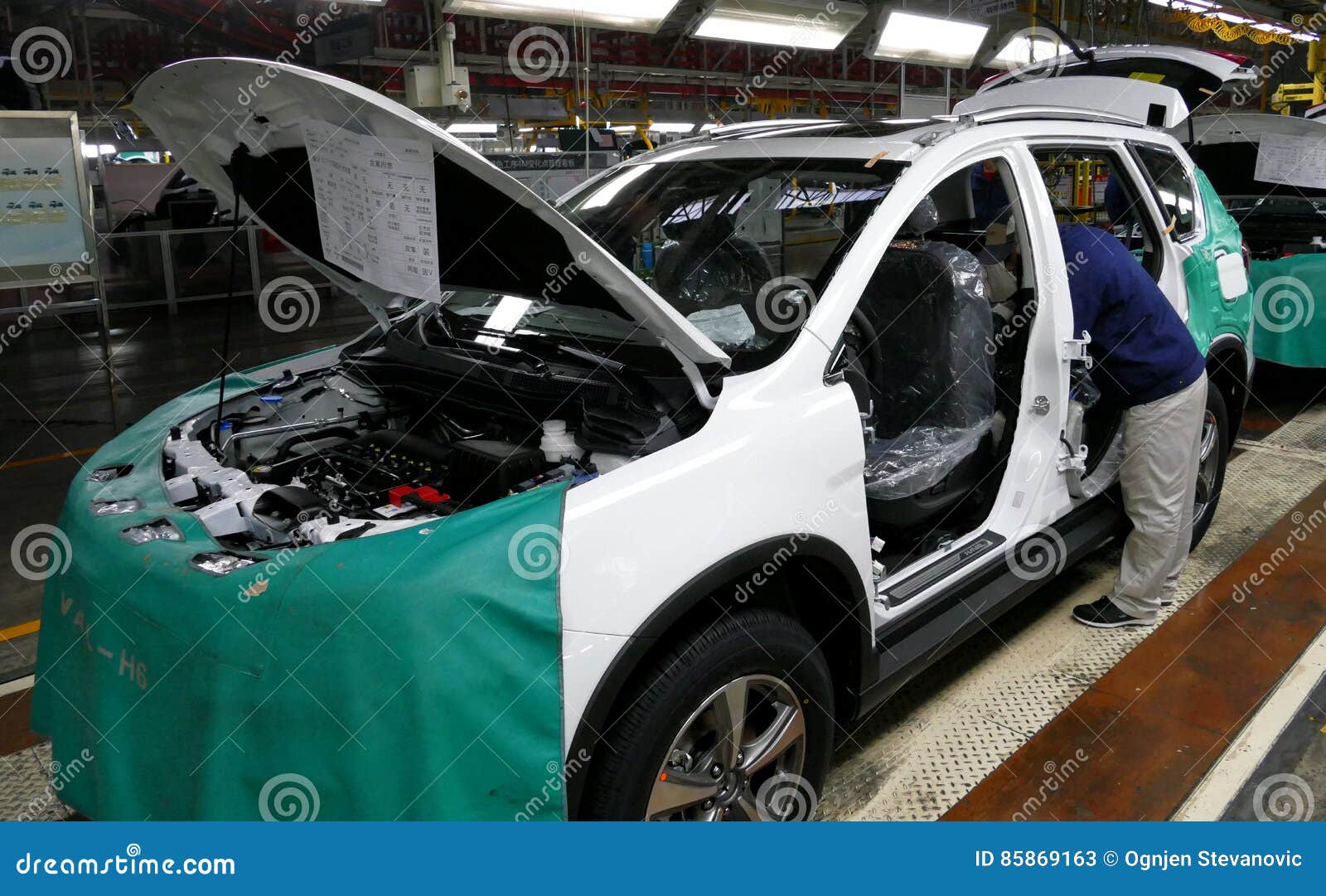 Workers Assemble a Car on Assembly Line in Car Factory Editorial Stock ... Workers Assemble a Car on Assembly Line in Car Factory Editorial Stock ...