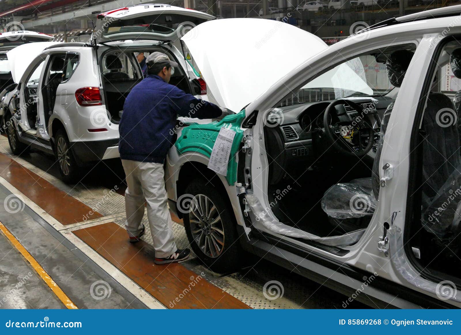 Workers Assemble a Car on Assembly Line in Car Factory Editorial Stock ... Workers Assemble a Car on Assembly Line in Car Factory Editorial Stock ...