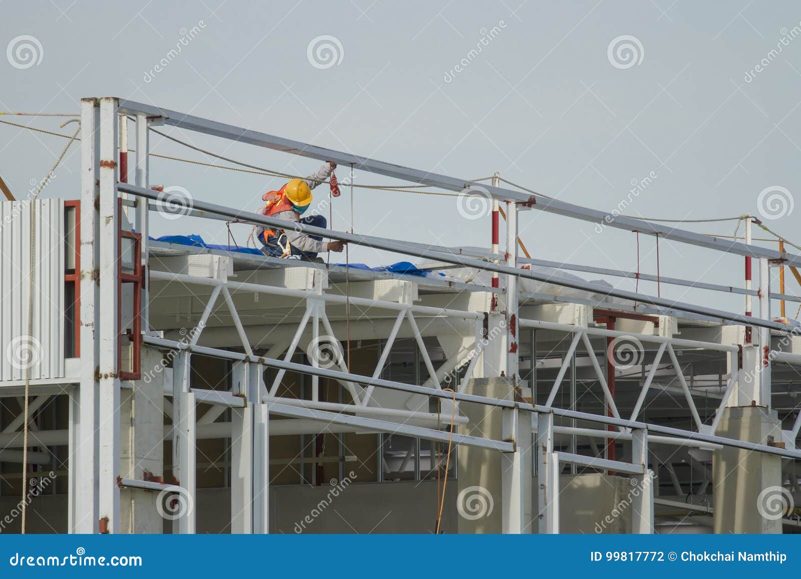 Workers in a Baskets are Installing Sheet, Building a Factory Editorial ...