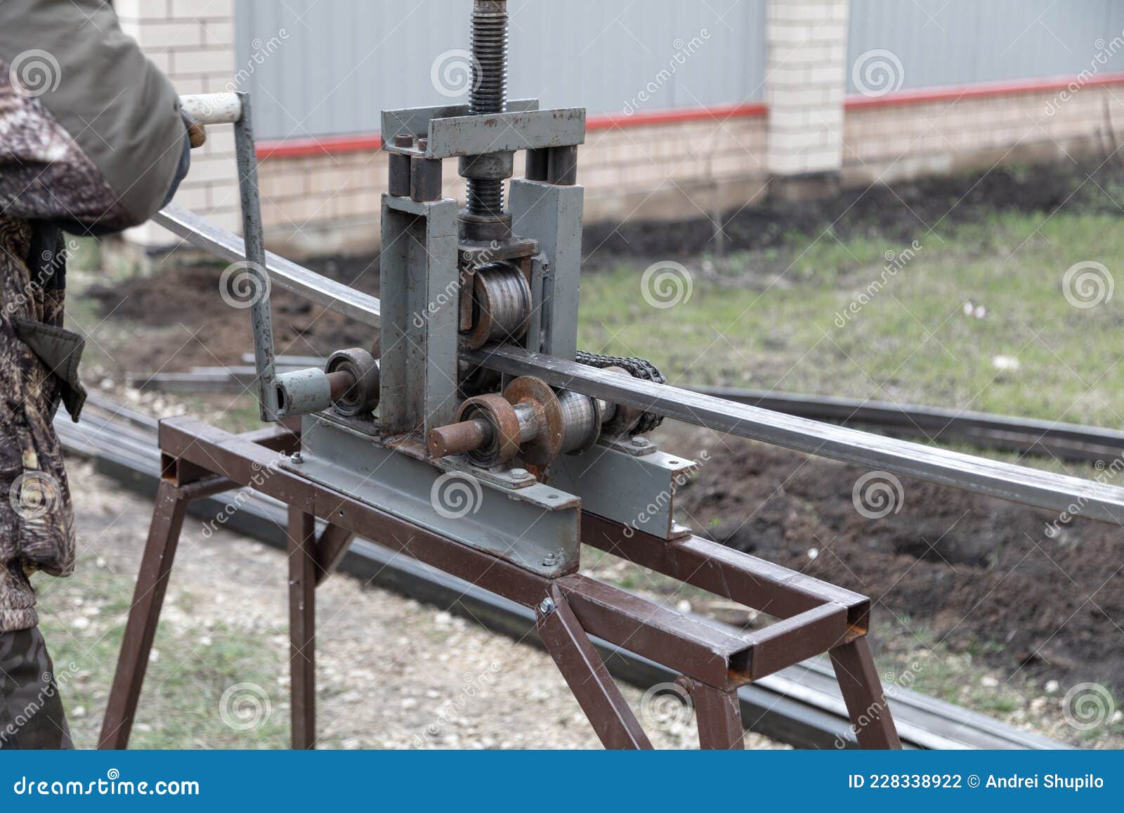Workers Bend Metal in a Pipe Bender. Stock Photo - Image of building ...