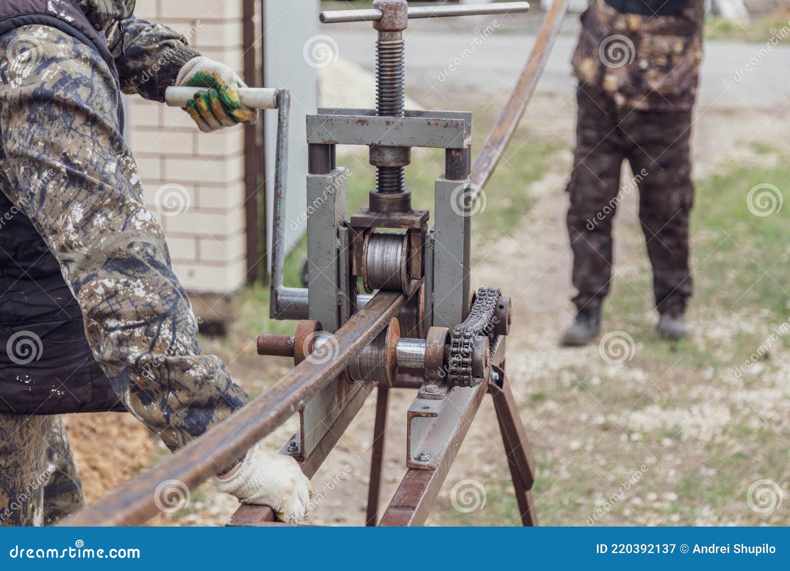Workers Bend Metal in a Pipe Bender. Stock Image - Image of metal ...