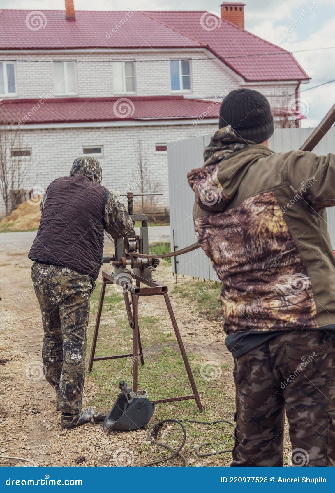 Workers Bend Metal in a Pipe Bender. Stock Photo - Image of ...